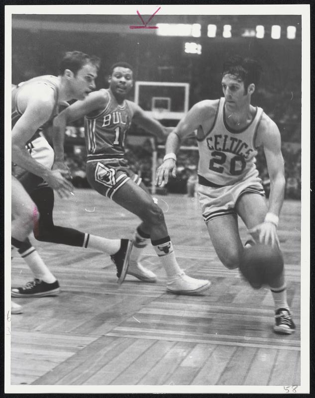 Infraction. Right, Larry Siegfried gets by Chicago guard Clem Haskins ...