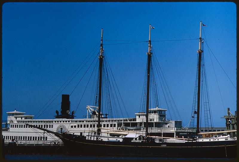 Side view of Eureka ferryboat and other boat docked at pier, San ...
