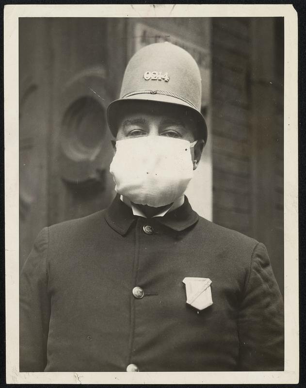 Boston patrolman, shown here in 1918 photo, wearing his face mask as ...