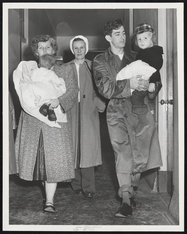 Winthrop Flood Refugees - S-Sgt. and Mrs. Archie Johnson, carrying ...