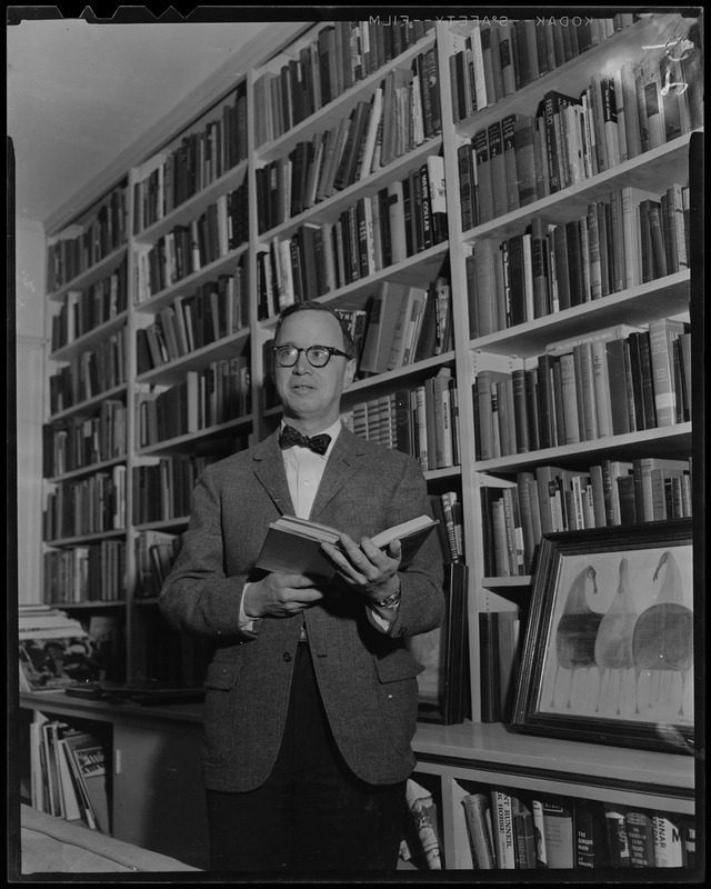 Arthur Schlesinger, Jr. standing, with book - Digital Commonwealth