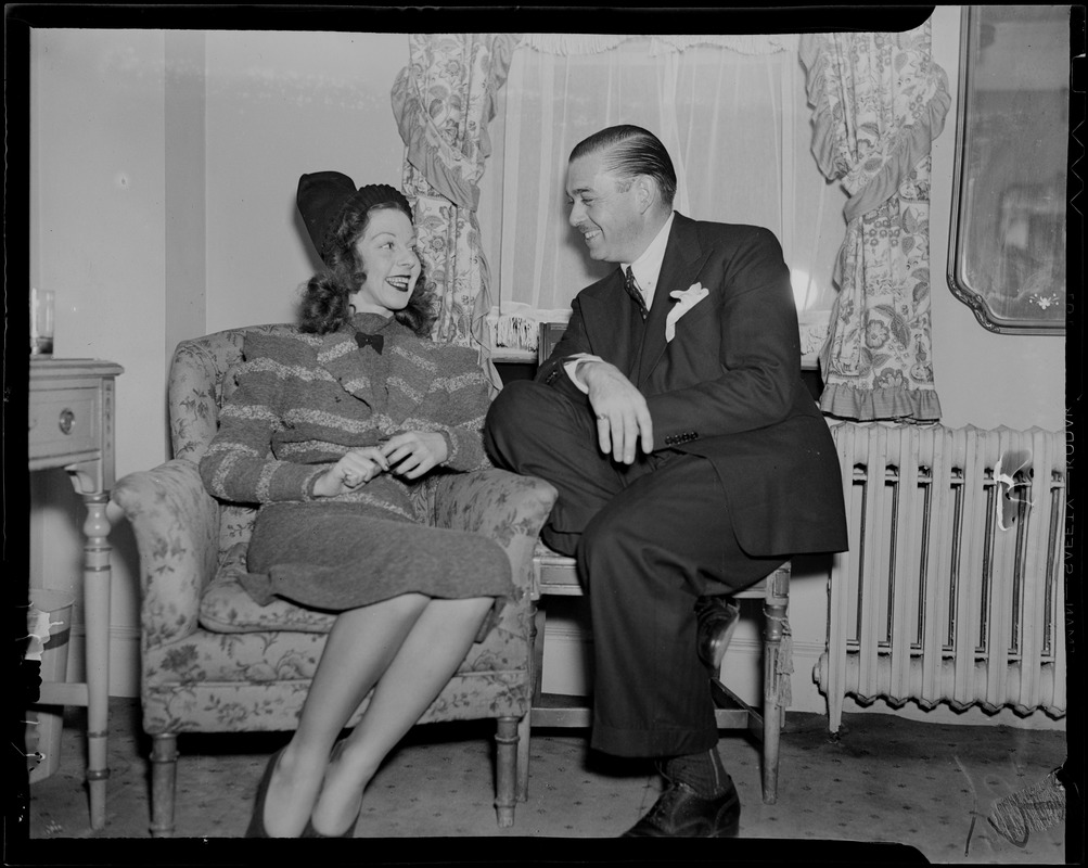 Morton Downey and Ann Marsters sitting next to each other in chairs ...