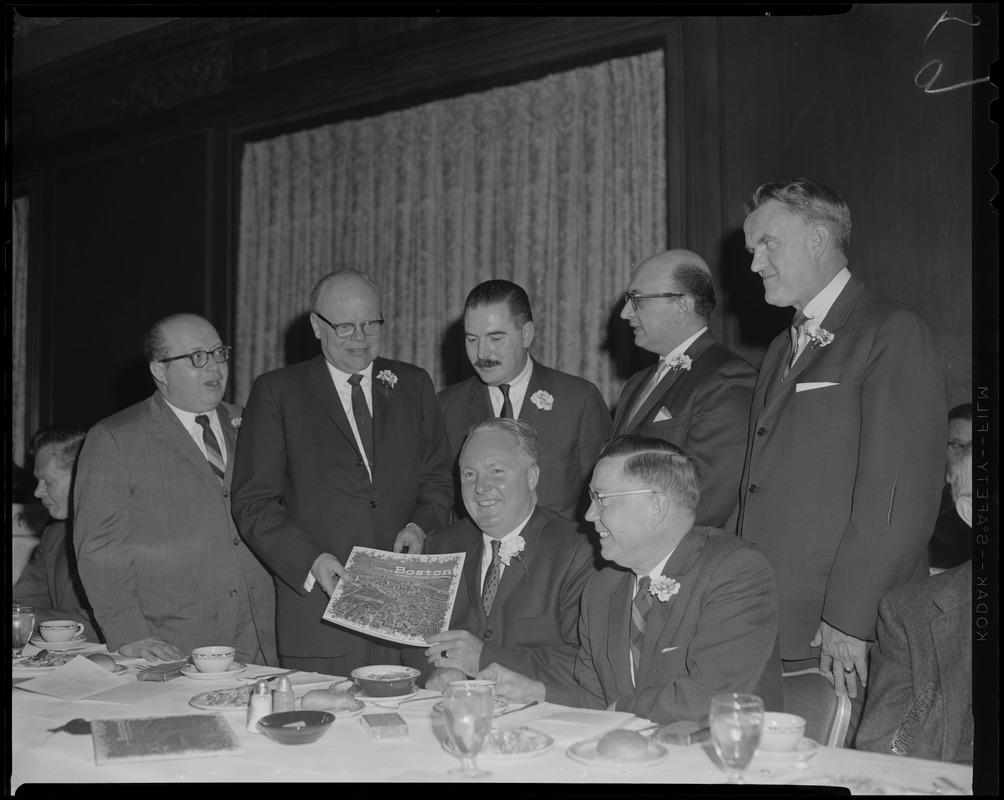 Mayor John F. Collins receiving the first copy of the second edition of ...