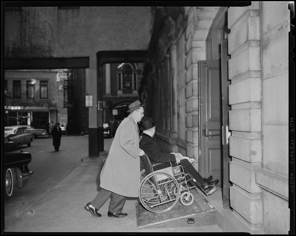 Man pushing Mayor Collins into the building - Digital Commonwealth