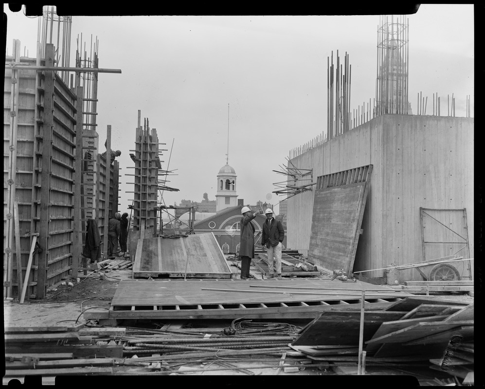 Two men standing in a construction site for a new City Hall in Boston ...