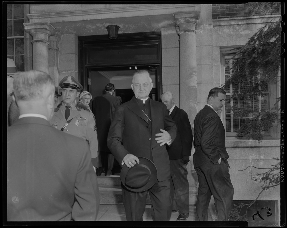 Clergyman walking out of the home for the viewing of former Governor ...