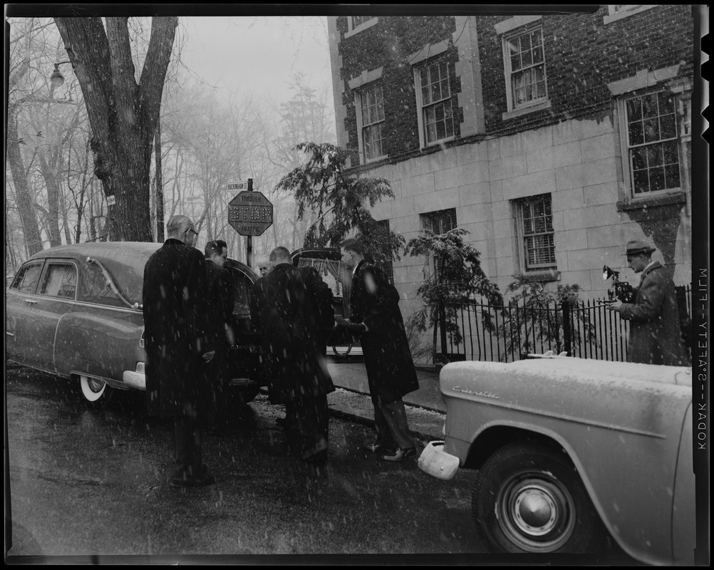 Pallbearers placing the coffin of former Governor Paul Dever into the ...