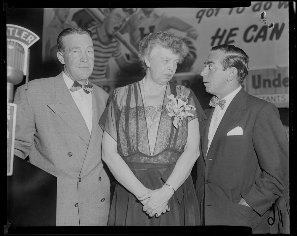 Eleanor Roosevelt standing between coach Frank Leahy of Notre Dame and ...