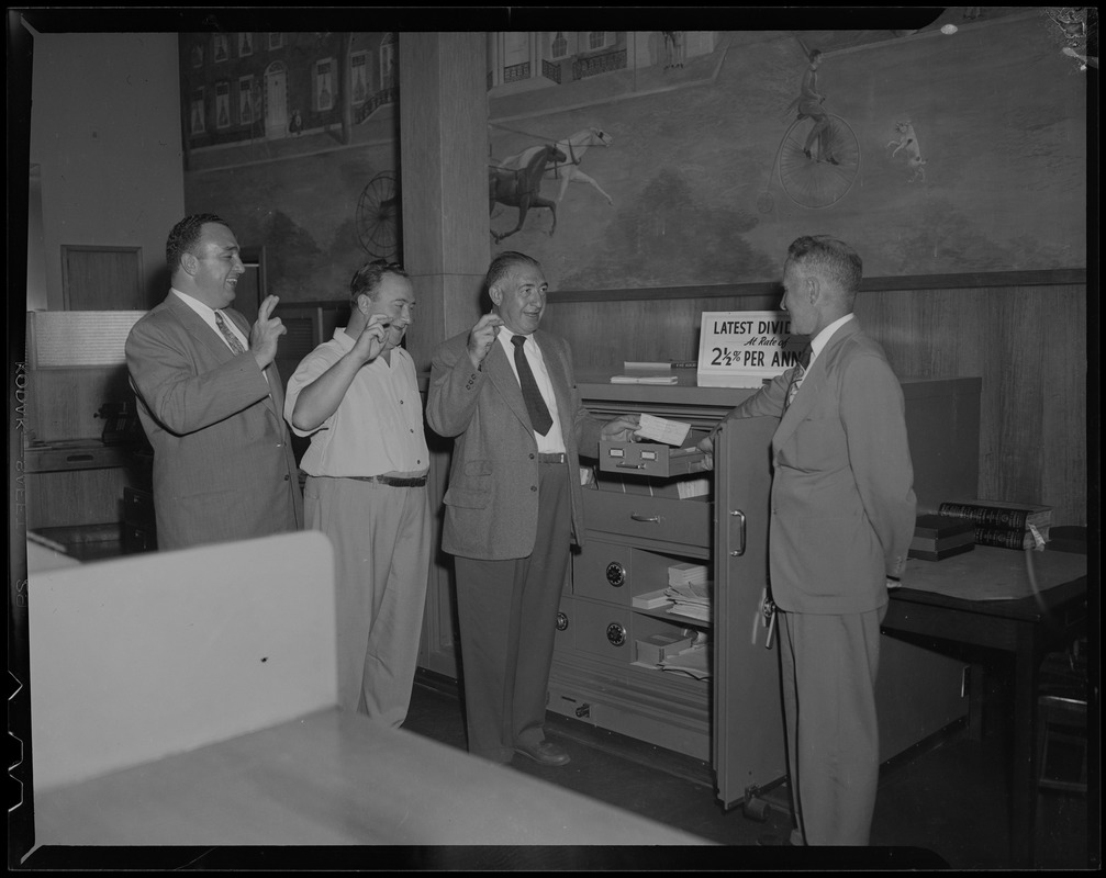 Three men crossing their fingers, including Sam Silverman, middle, in a ...