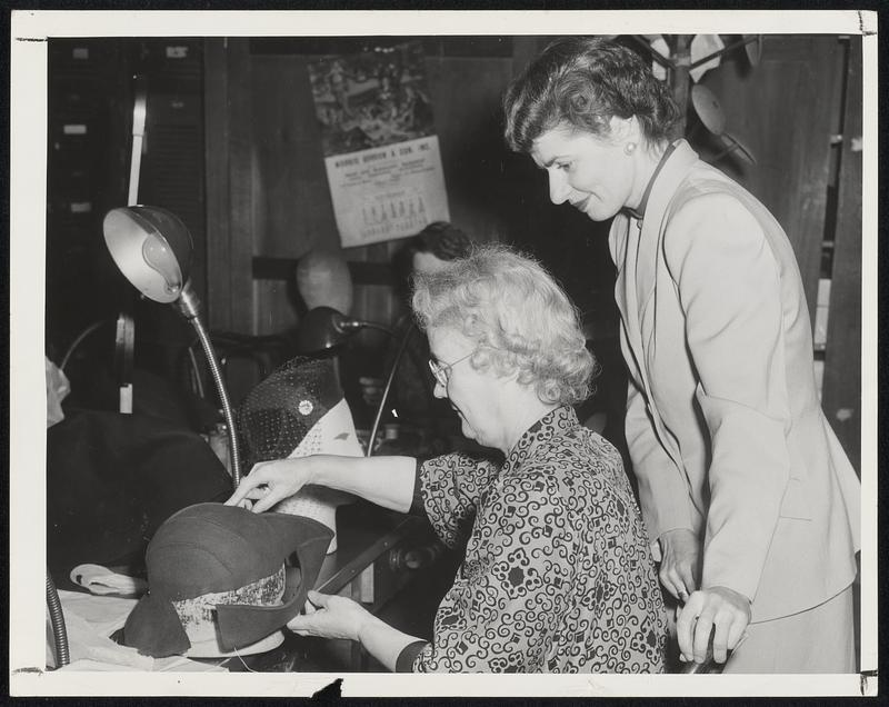 With Customer Now Kibitzing, hat maker shapes hat to form and ...