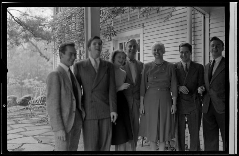 Group of seven people standing in front of house - Digital Commonwealth