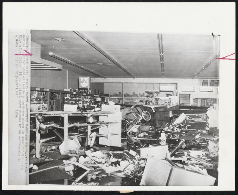 Wrecked Hardware Store -- An automobile is shown washed inside a ...