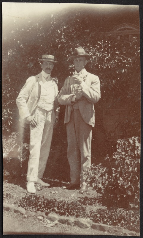 Two well-dressed gentlemen standing in garden - Digital Commonwealth