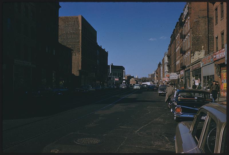View down street with left side in shadow - Digital Commonwealth