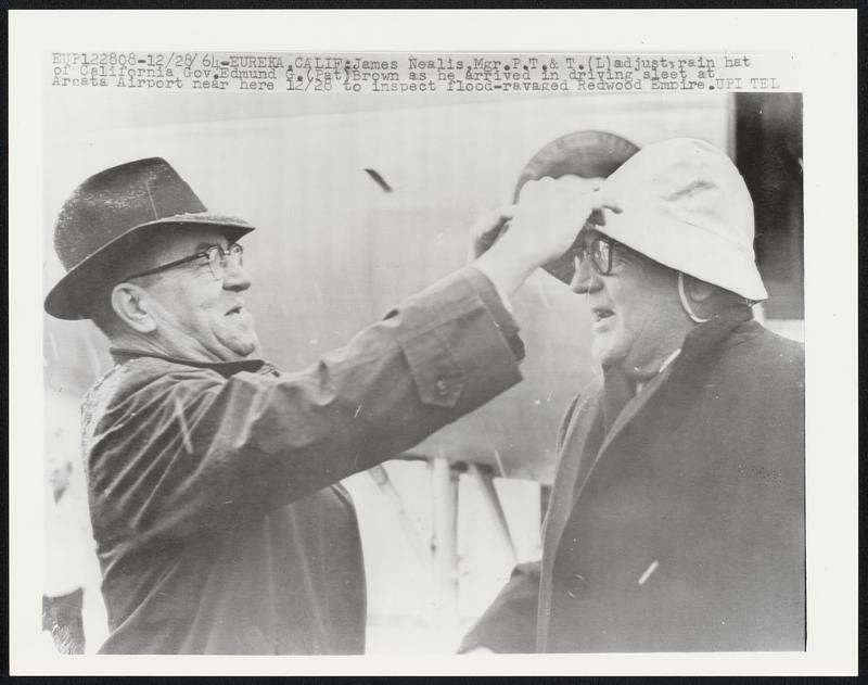 James Nealis, Mgr. P.T. & T. (L) adjust rain hat of California Gov ...