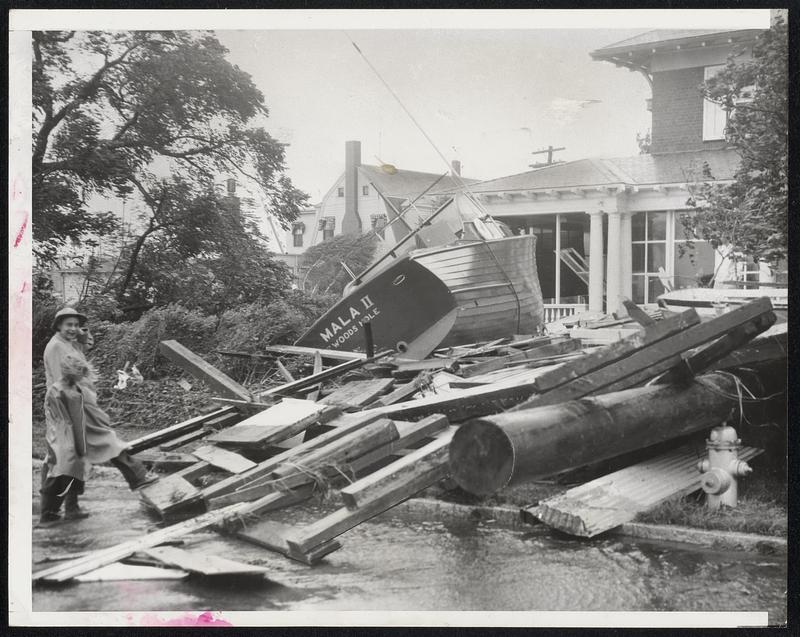 Beached on a Lawn-Hurricane Carol left this power cruiser high and dry ...
