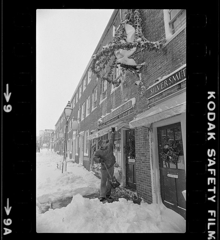 Shoveling snow in front of silversmith shop - Digital Commonwealth