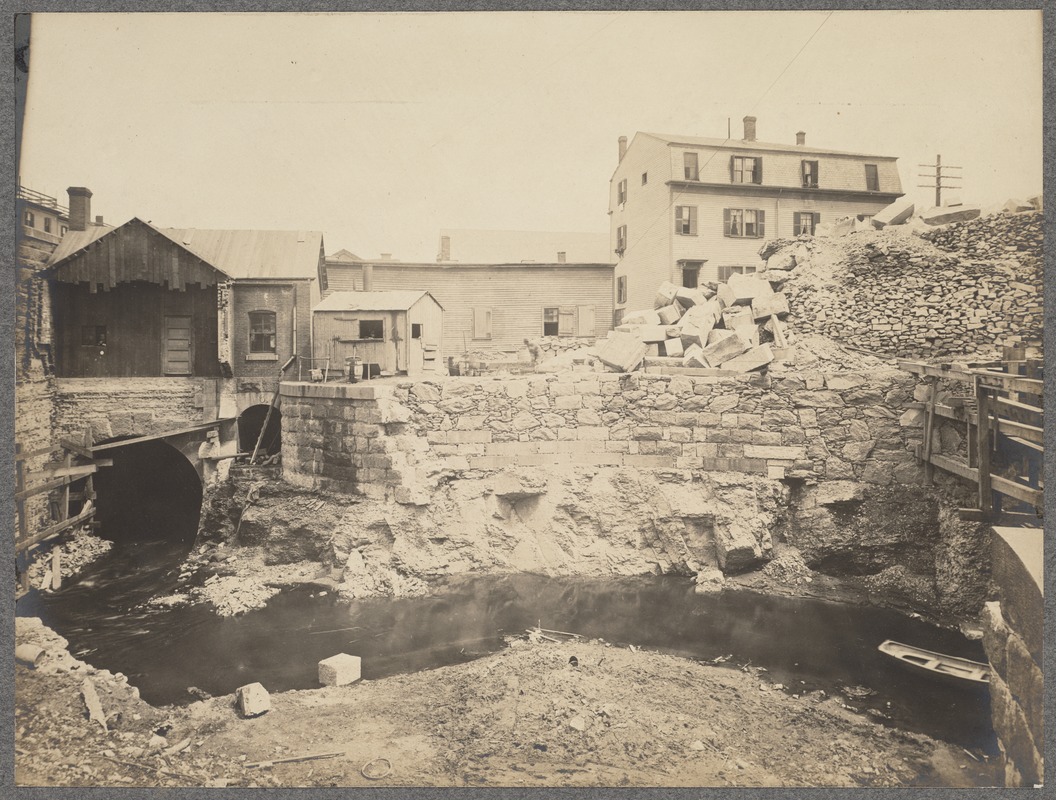 Water emerging from under building - Digital Commonwealth