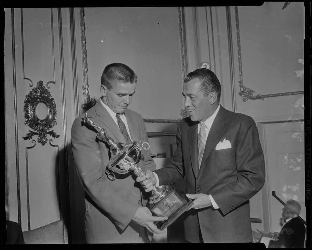 Donald Allard of Boston College holds sports award with Ed Sullivan ...