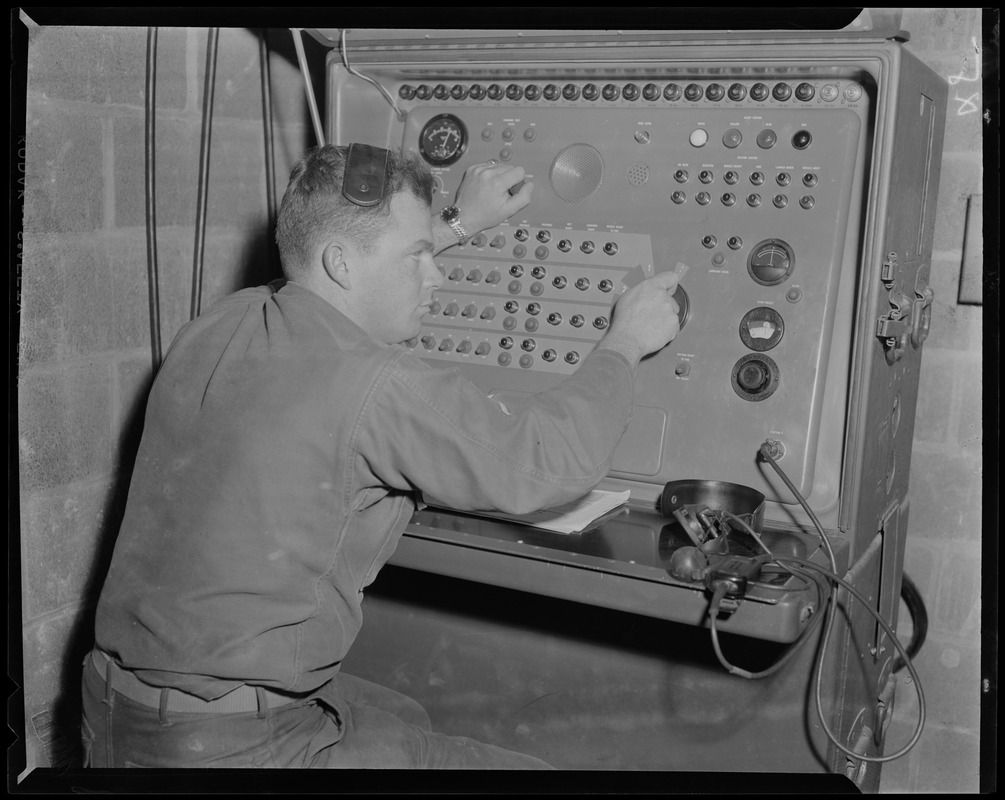 Man operating missile control panel - Digital Commonwealth