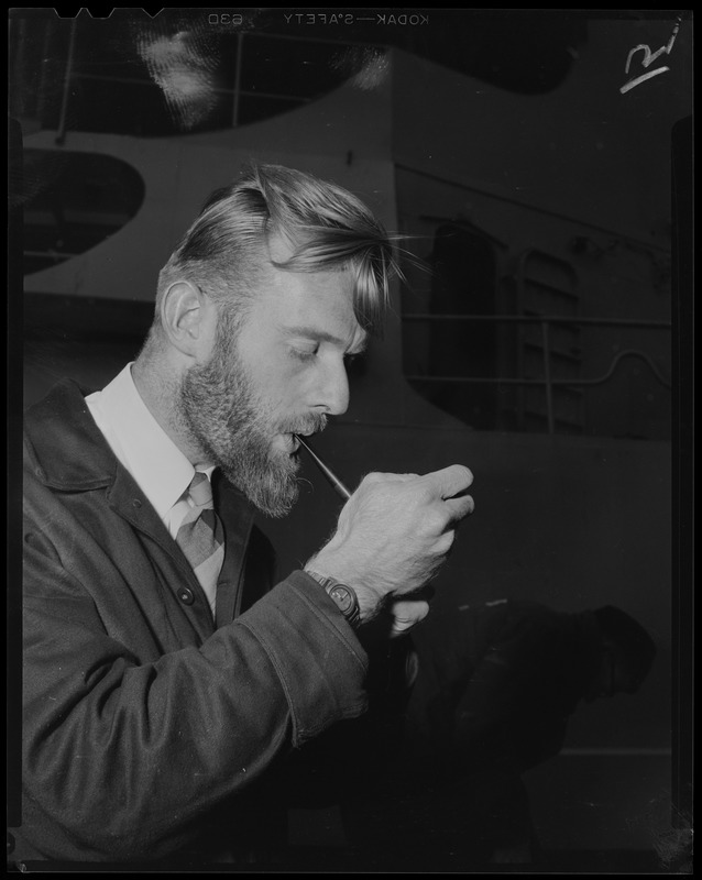 Man lighting pipe - Digital Commonwealth