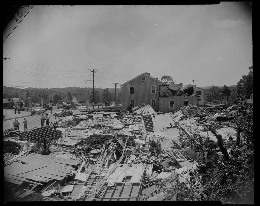 Housing destruction, with one house missing part of second floor ...