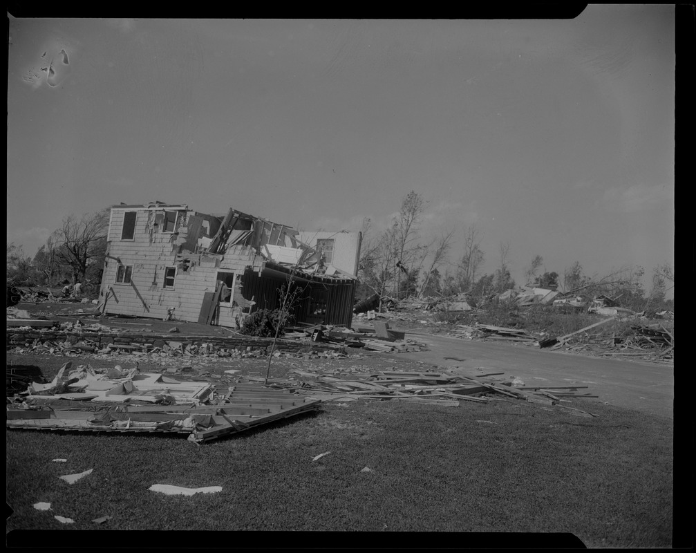 Standing building missing an exterior wall and roof, tilting to the ...