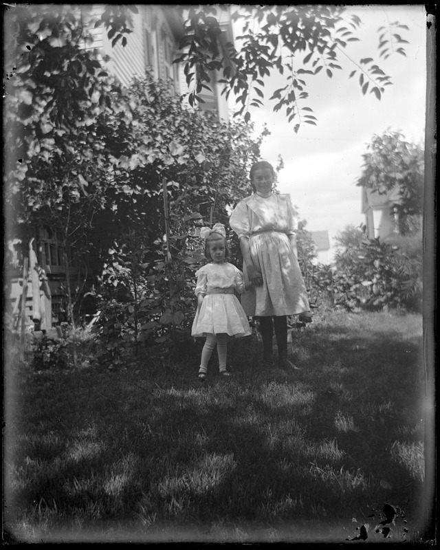 Mabel Wilhelm holding the hand of a girl - Digital Commonwealth