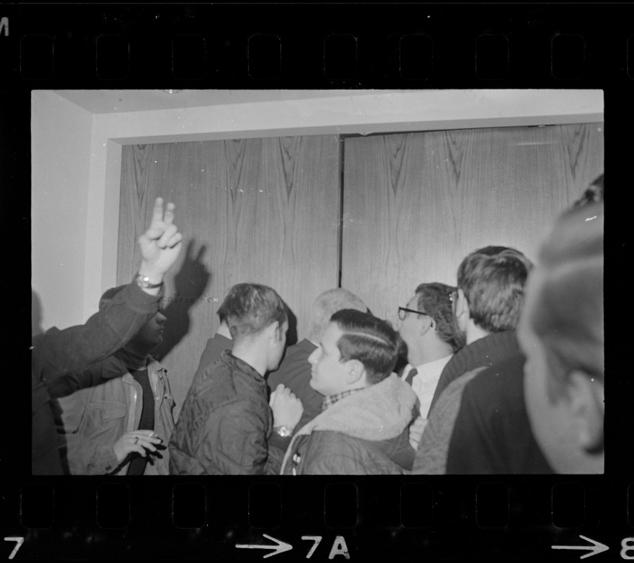 Students gathered outside the closed door of MIT Corporation during ...