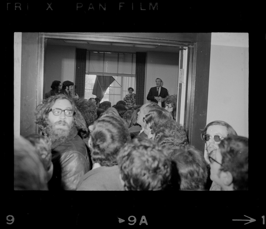 Students gathered outside of a meeting room during MIT student ...