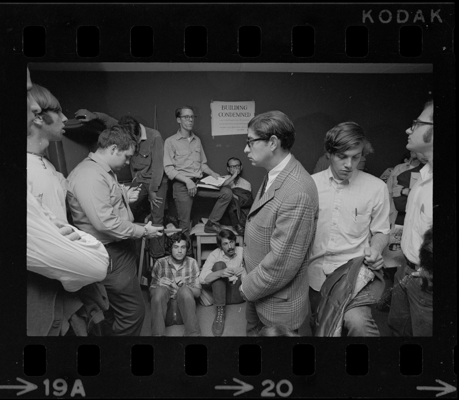 Men and students gathered in a classroom during MIT student ...