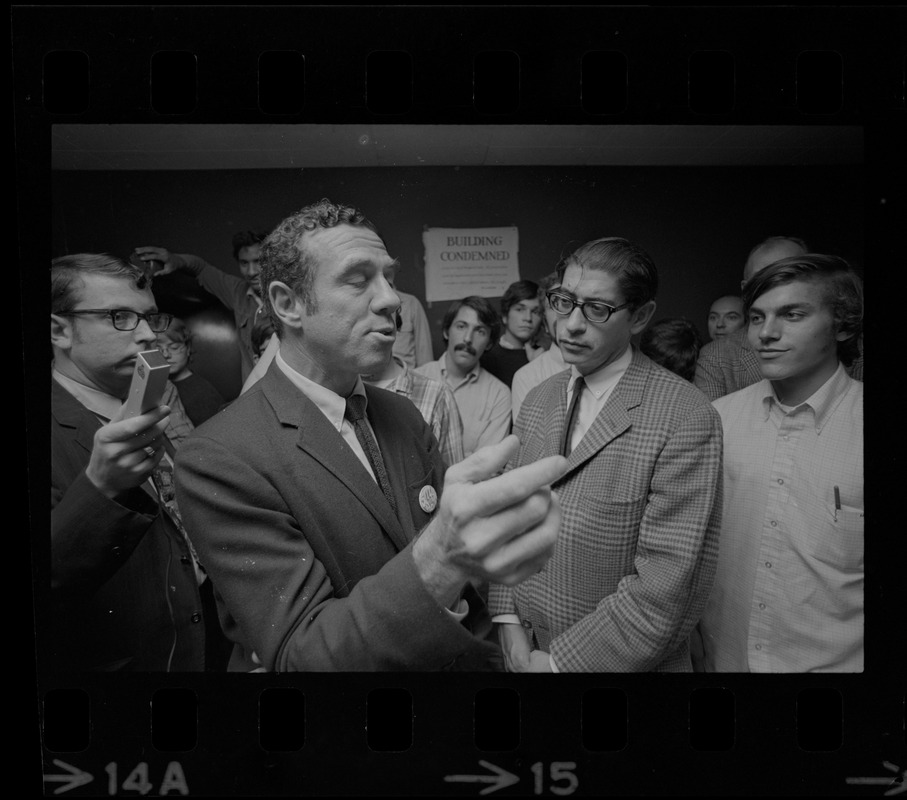 Man surrounded by and speaking to MIT SDS members and others during ...