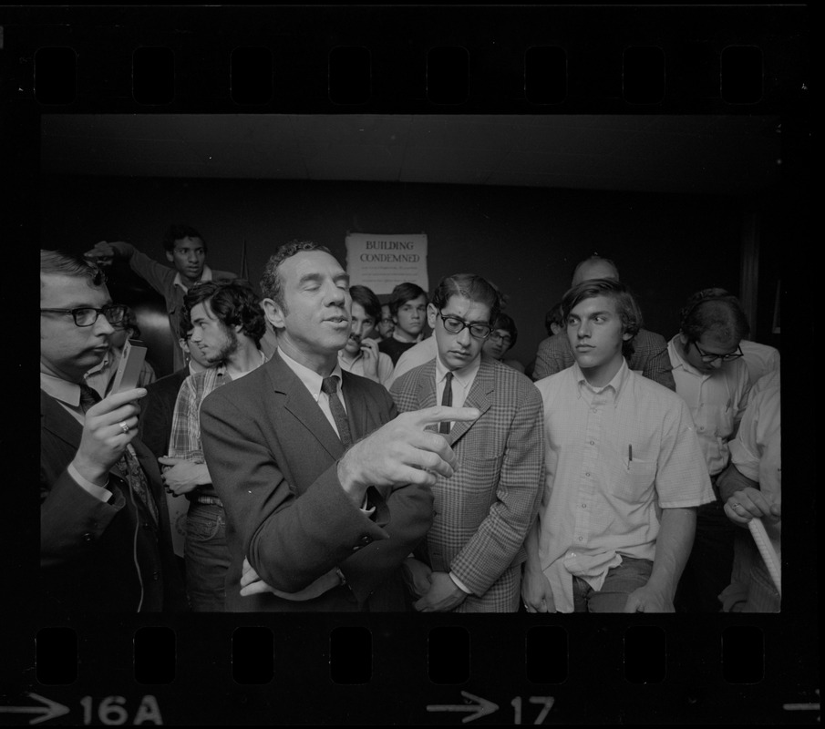 Man surrounded by and speaking to MIT SDS members and others during ...