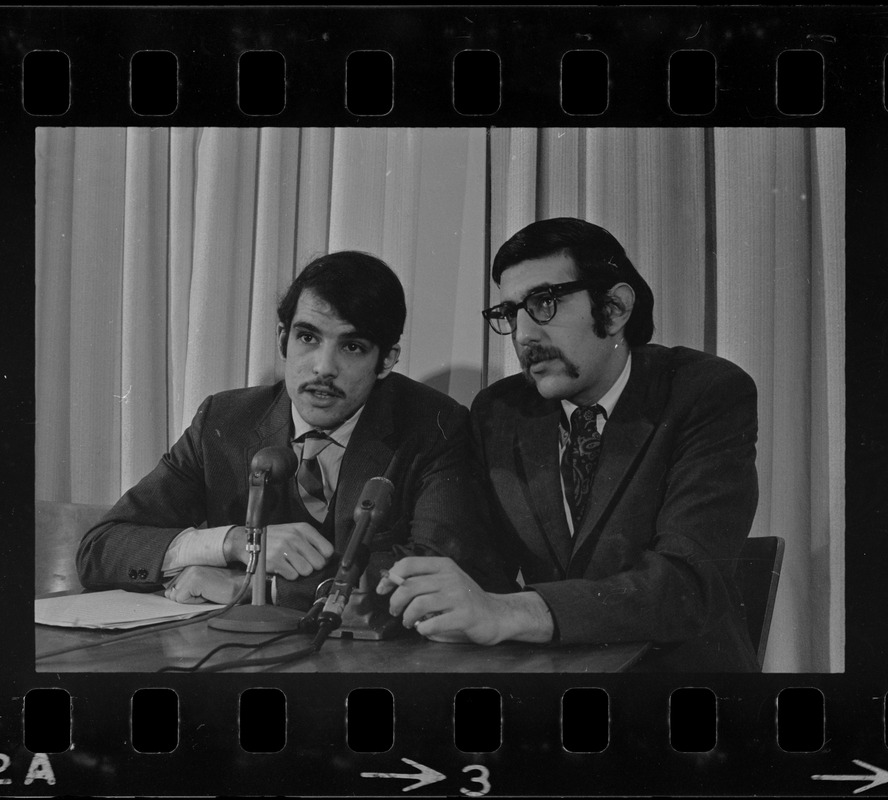 Two men speaking at a press conference - Digital Commonwealth