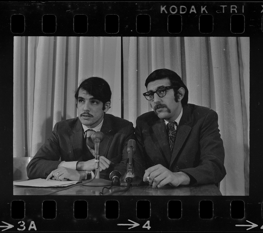 Two men speaking at a press conference - Digital Commonwealth