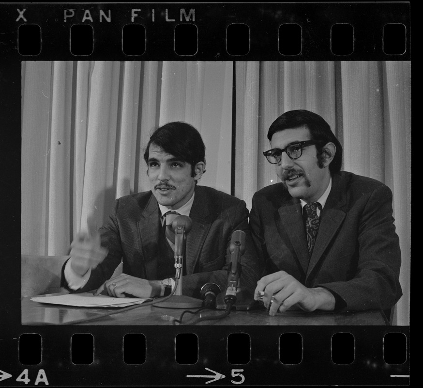 Two men speaking at a press conference - Digital Commonwealth