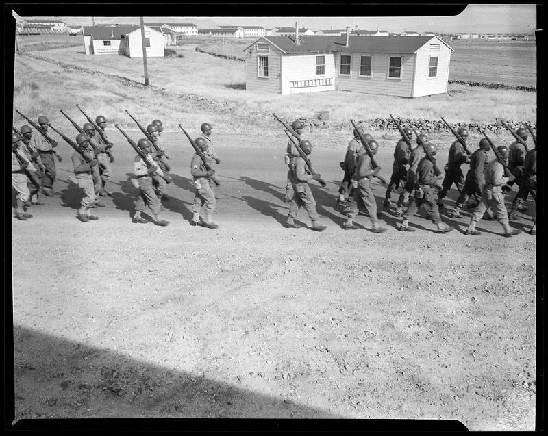 Soldiers marching in formation, buildings in background - Digital ...