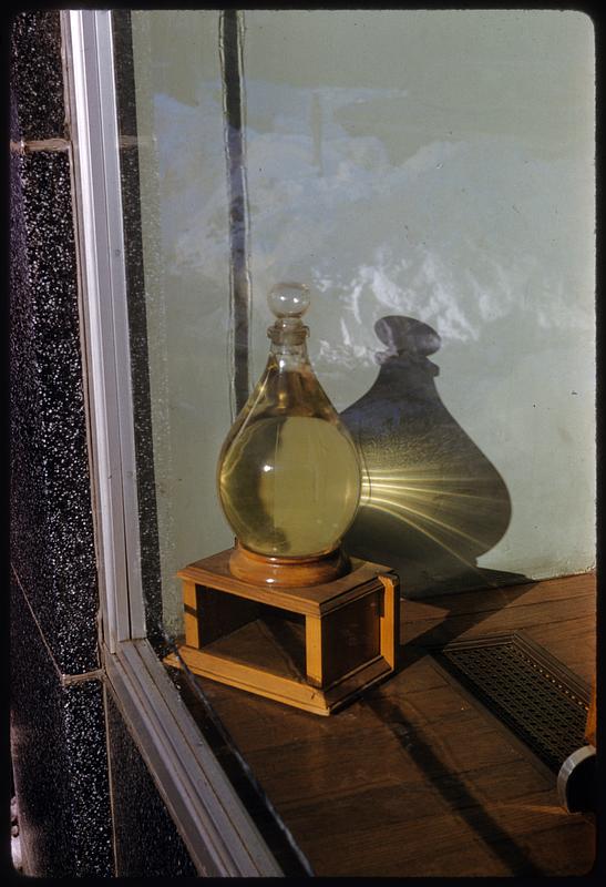 Bottle in Cheney window - Digital Commonwealth