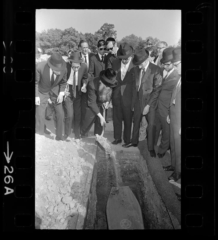 Jewish men bury fire-damaged Torah scrolls, Mattapan - Digital Commonwealth