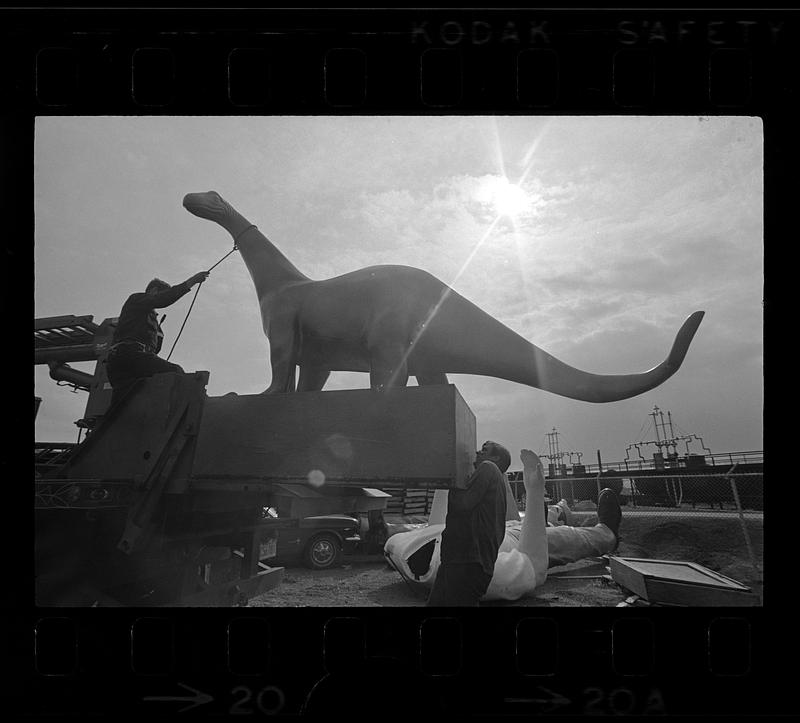 Sinclair Oil dinosaur advertising sign unloaded, East Boston - Digital ...