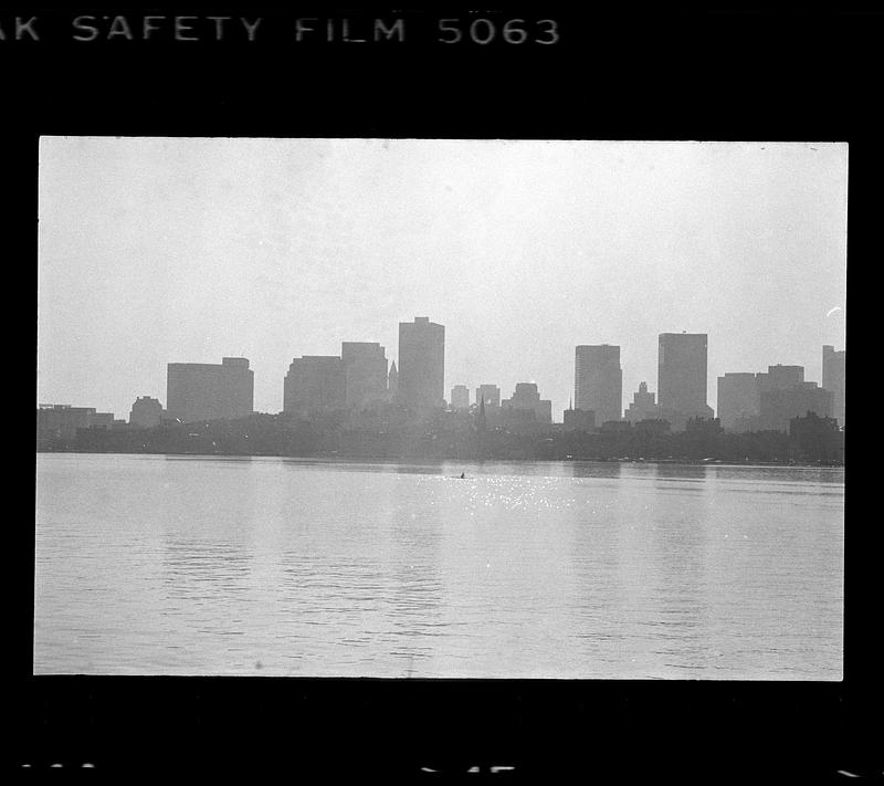 Single scull on Charles River Basin, downtown Boston - Digital Commonwealth