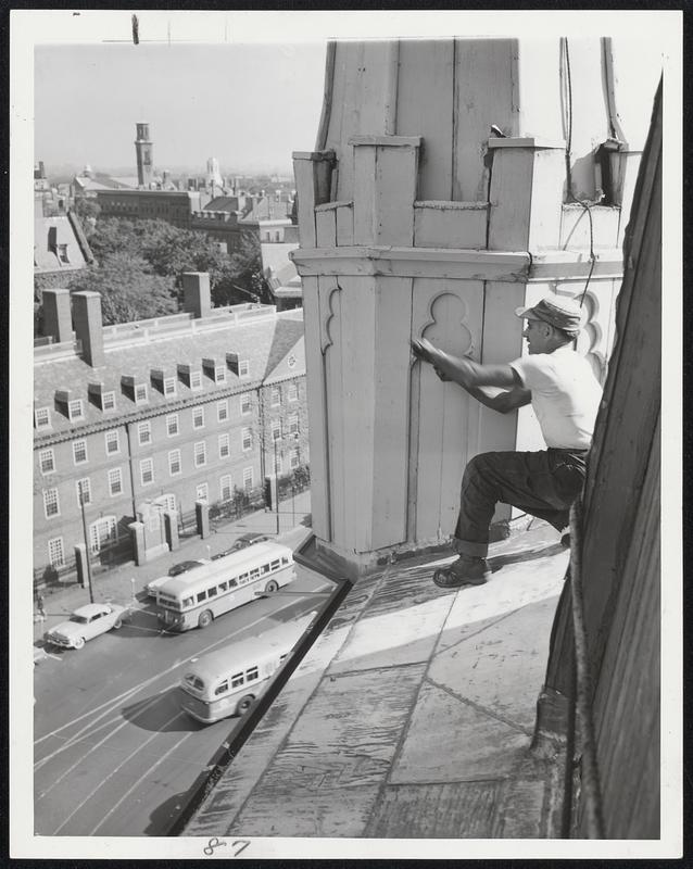 At right, John Gilbert of Dorchester works on the tower 100 feet above ...