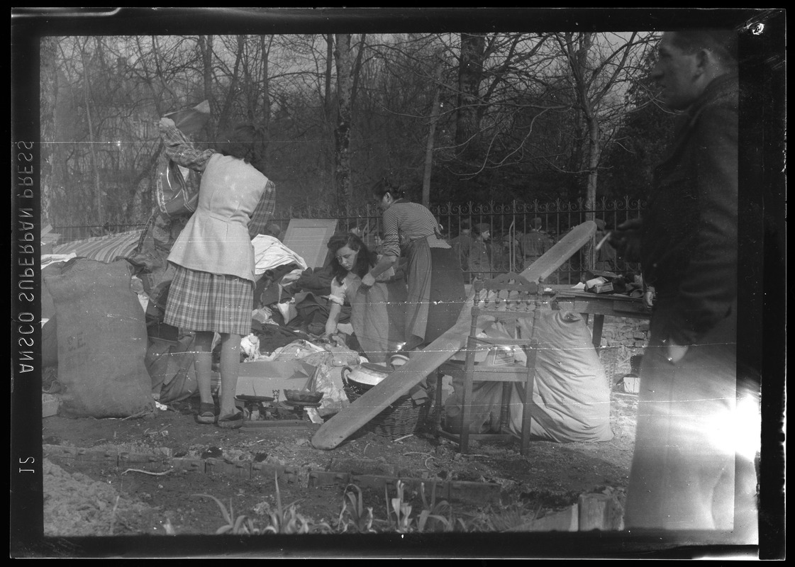 People sorting through salvaged items, Rambervillers, France - Digital ...