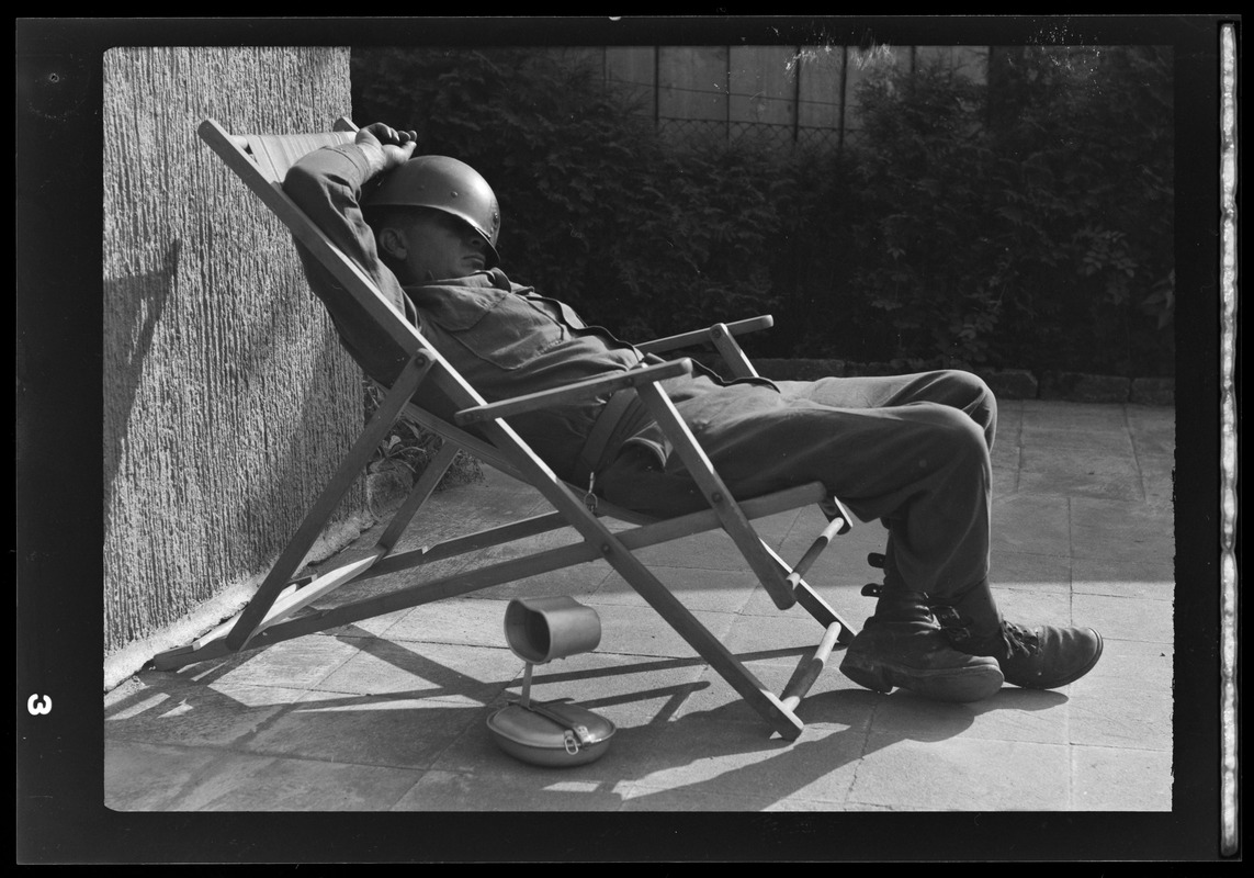 U. S. Army soldier napping in cabana chair, Waiblingen, Germany ...