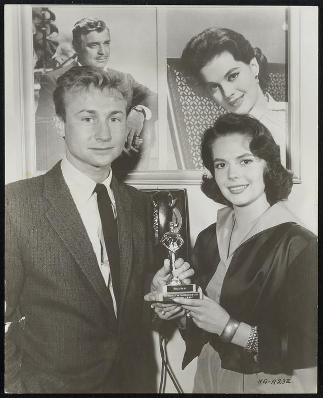 Nick Adams shows his friend Natalie Wood the "Pierre" Statuette awarded ...