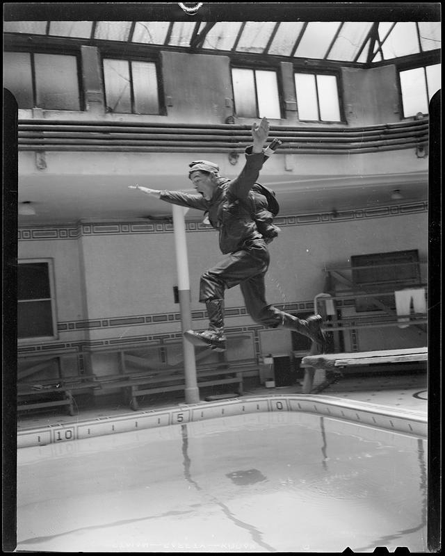 Soldier jumping into McCurdy pool - Digital Commonwealth