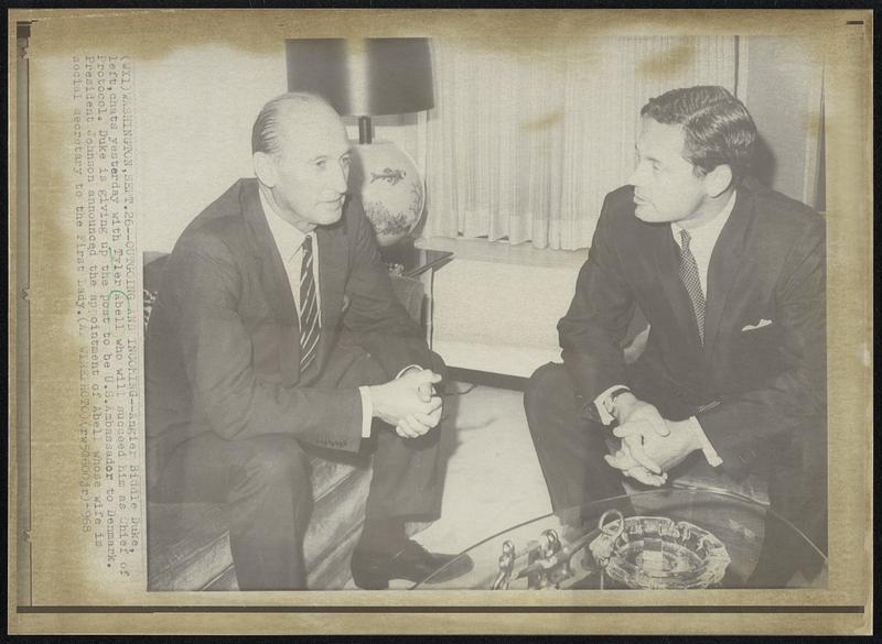 Outgoing and Incoming-- Angier Biddle Duke, left, chats yesterday with ...