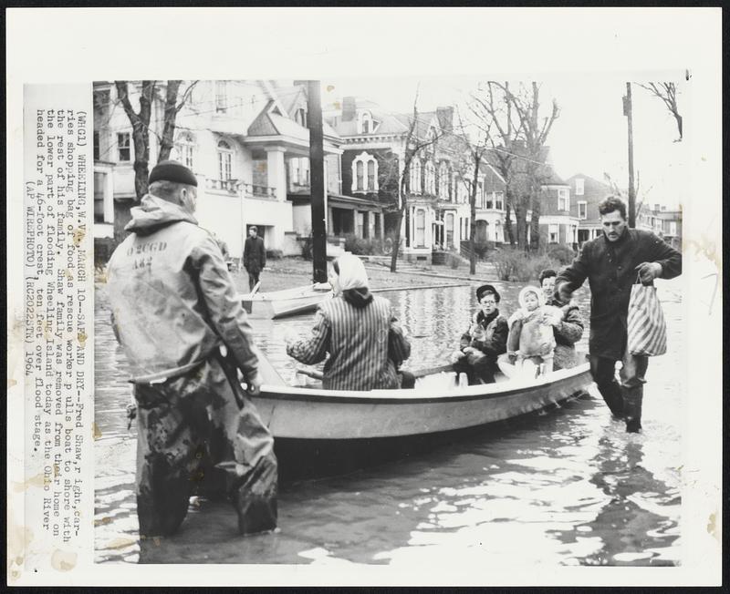 Safe and Dry--Fred Shaw, right, carries shopping bag of food as rescue ...