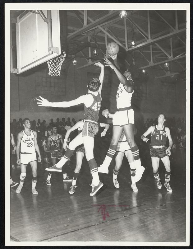 Flying High - Artie Johnson (24) of Boston English shoots over defender ...