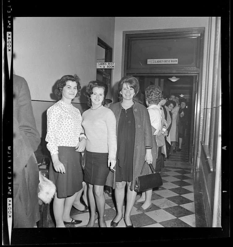 Group of women in a line outside of the women's restroom of courthouse ...